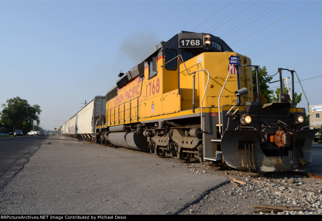 UP SD40N #1768 leads the northbound Cache Valley Local (LCG-41C) near 500 N and 600 W. in Logan ...